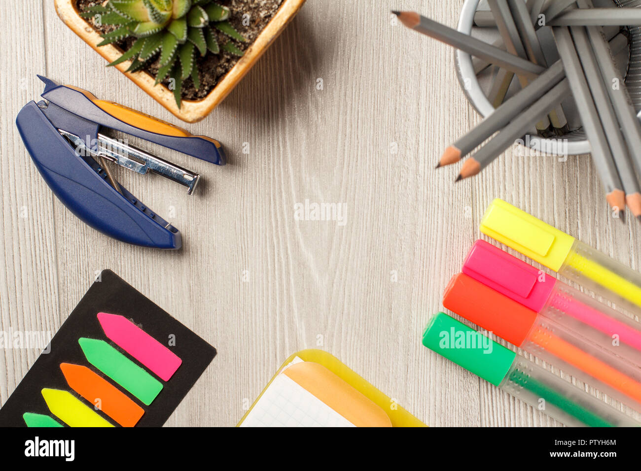 School and office work supplies. Color bookmarks, stapler, houseplant ...