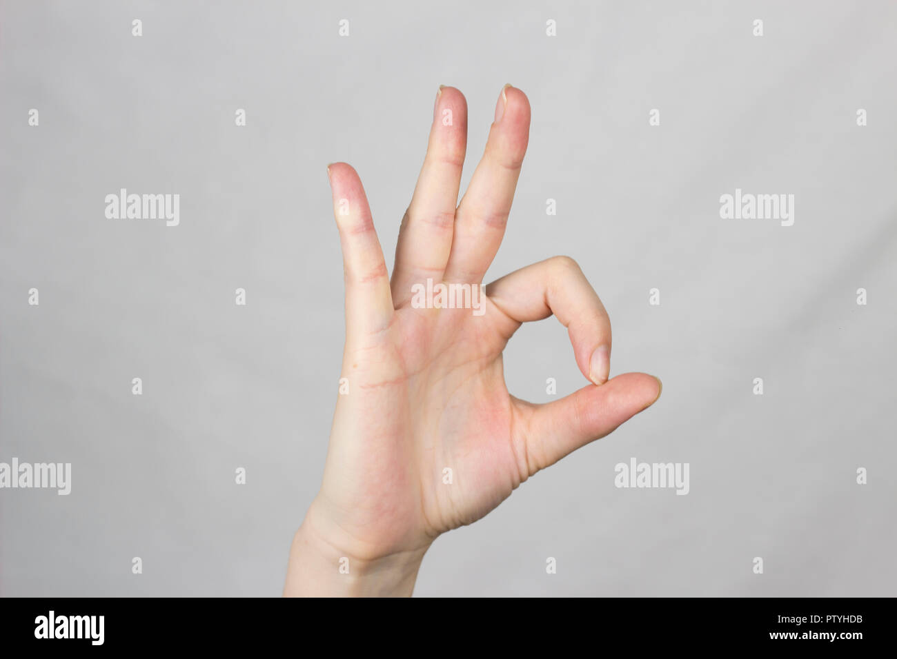 Hand gesture on a white background everything is good Stock Photo - Alamy
