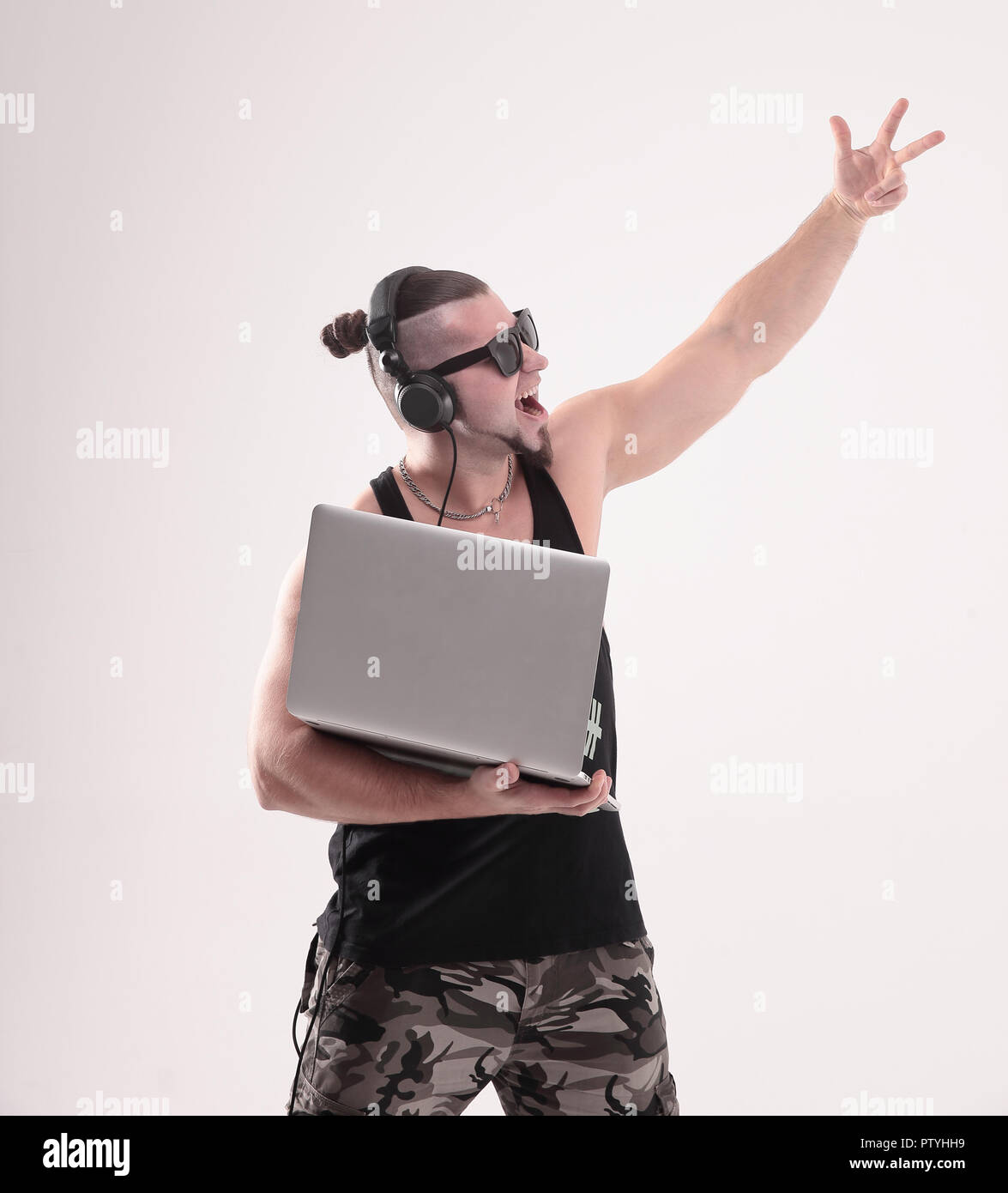 happy DJ-rapper with an open laptop .isolated white background Stock ...