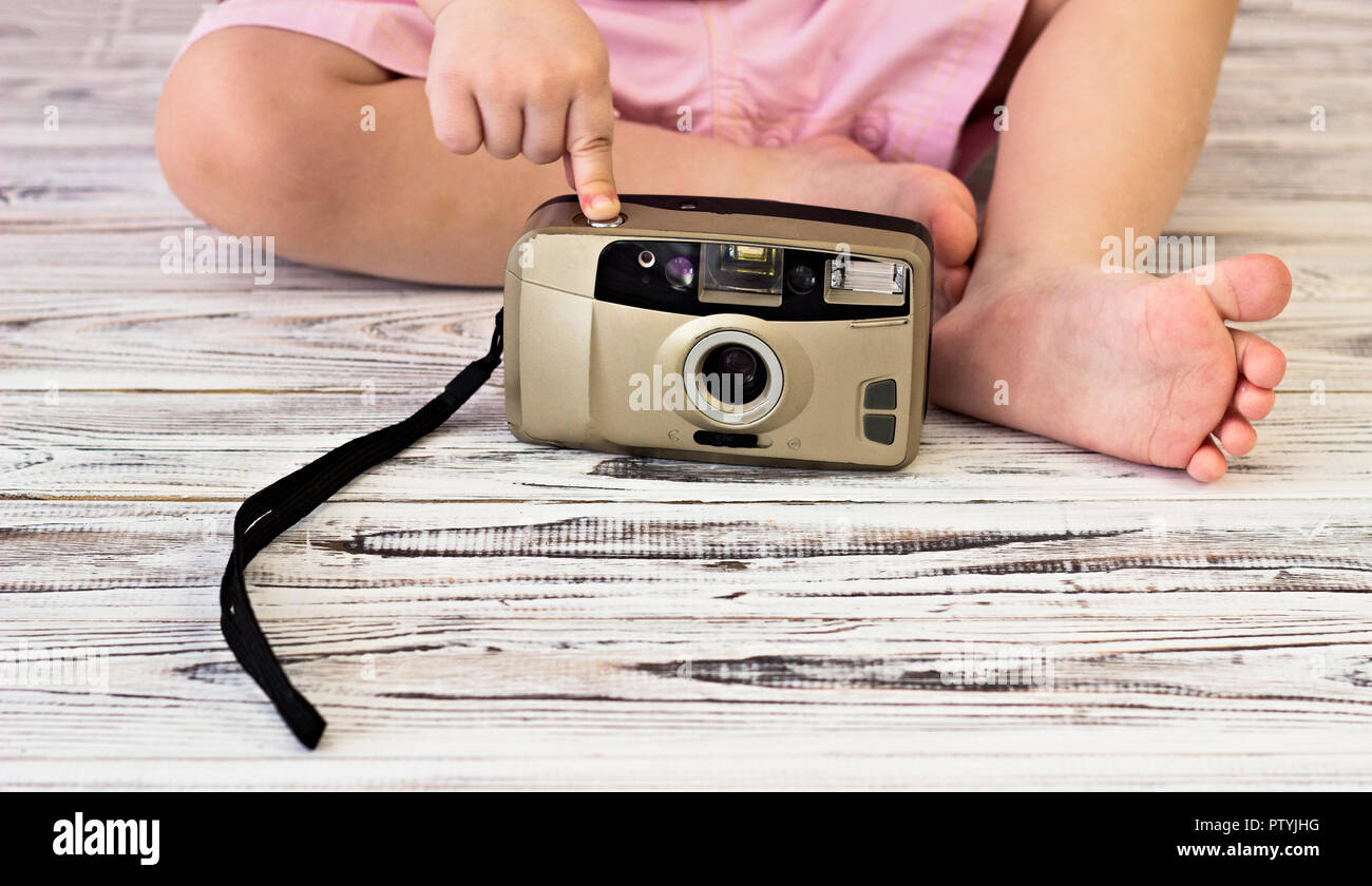 Little girl playing with camera, close-up Stock Photo - Alamy