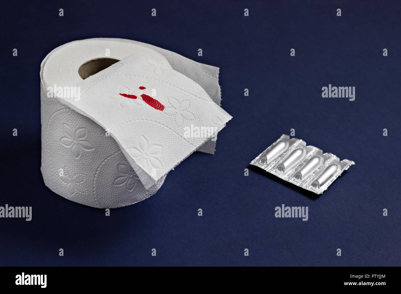 Toilet paper with blood and rectal suppositories against hemorrhoids ...