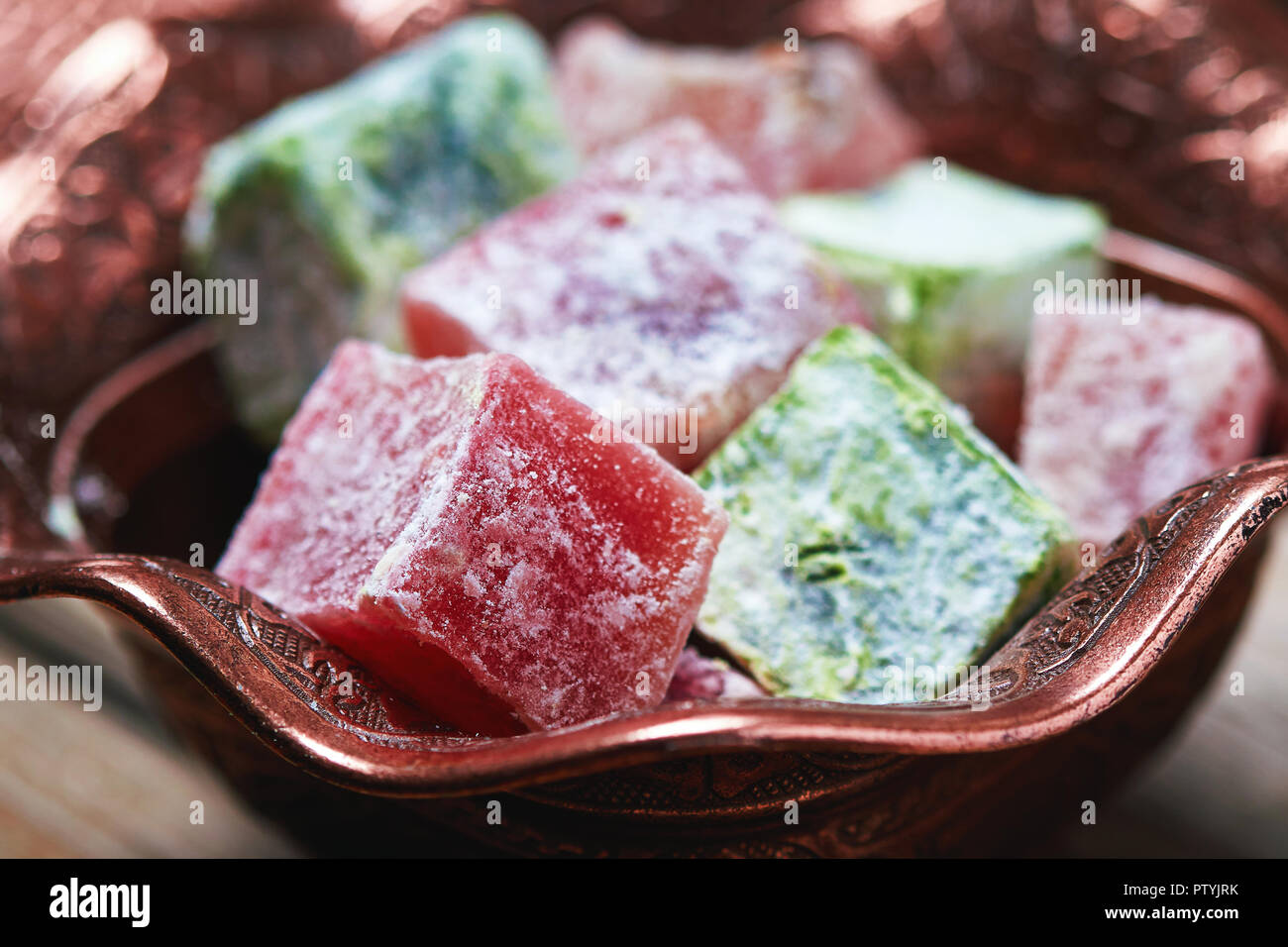 Turkish delight (lokum) in traditional oriental carved patterned metal ...