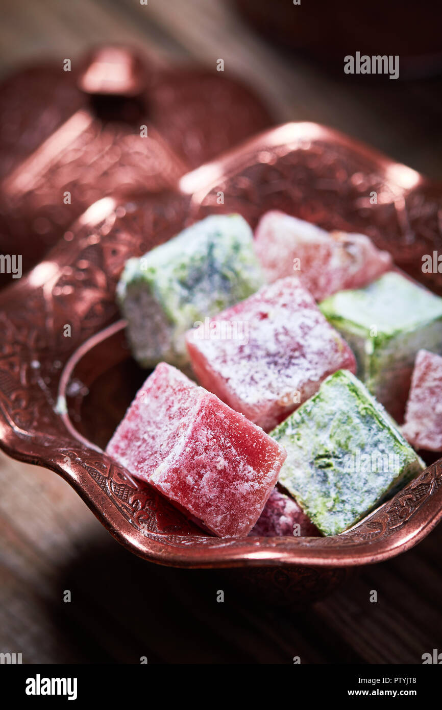 Turkish delight (lokum) in traditional oriental carved patterned metal ...