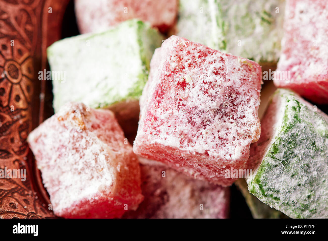 Turkish delight (lokum) in traditional oriental carved patterned metal ...