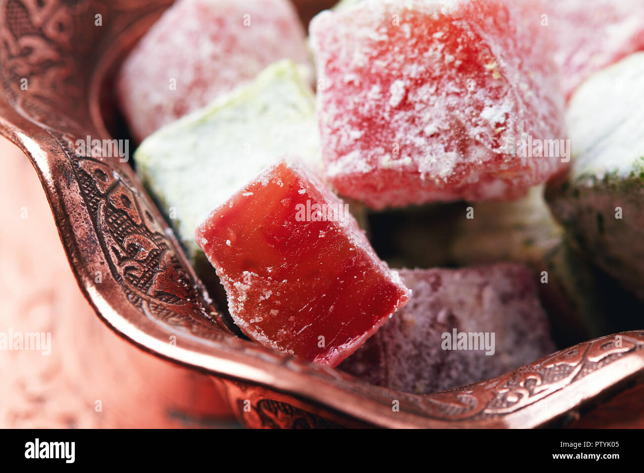 Turkish delight (lokum) in traditional oriental carved patterned metal ...