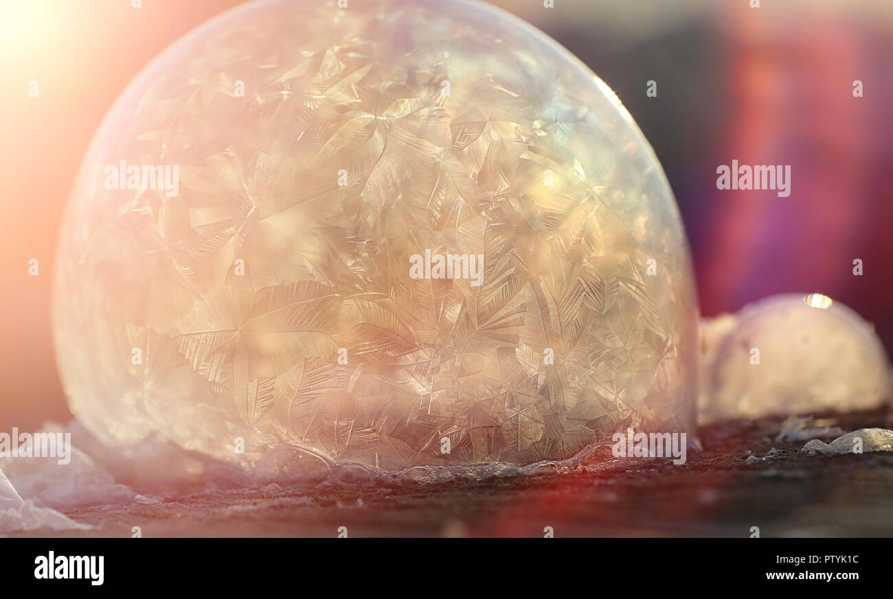Soap bubbles freeze in the cold. Winter soapy water freezes in air ...