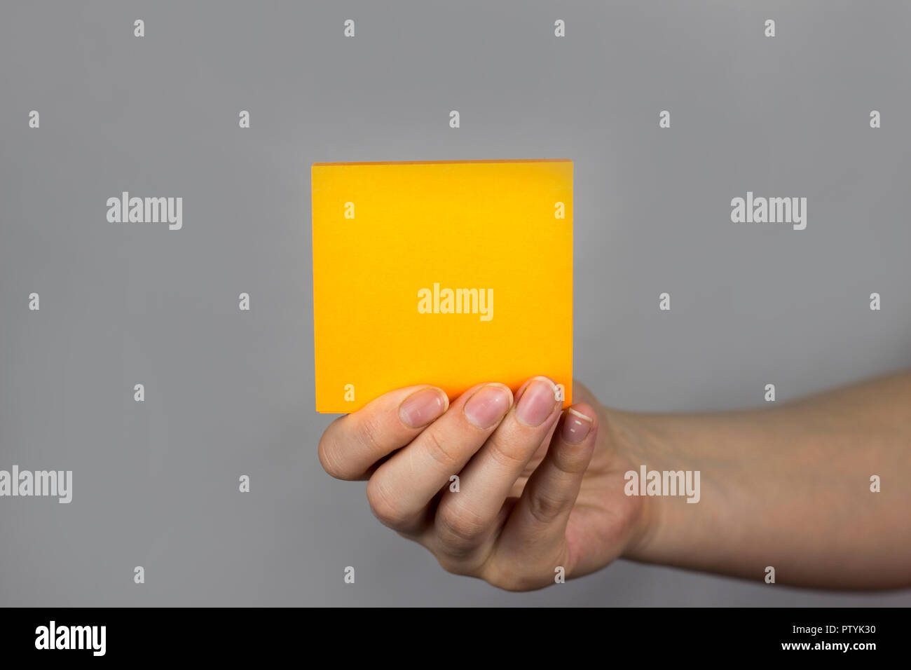 Girl holding an empty sticker Stock Photo - Alamy