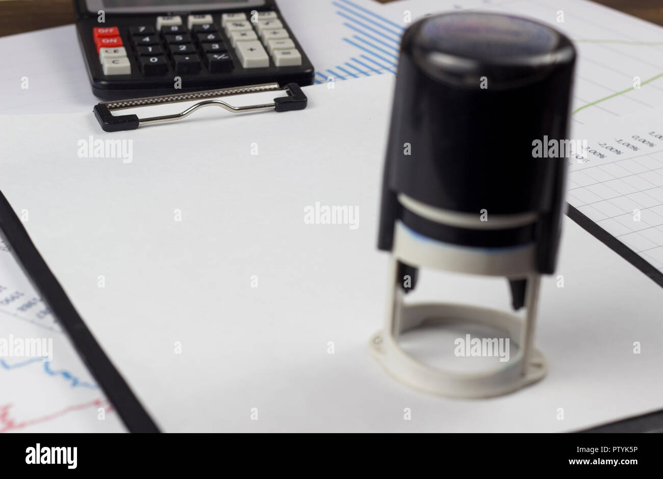 Print on an empty sheet and calculator Stock Photo - Alamy
