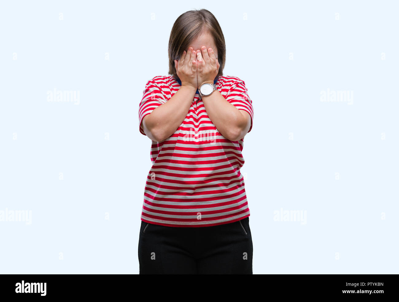 Young adult woman with down syndrome over isolated background with sad ...