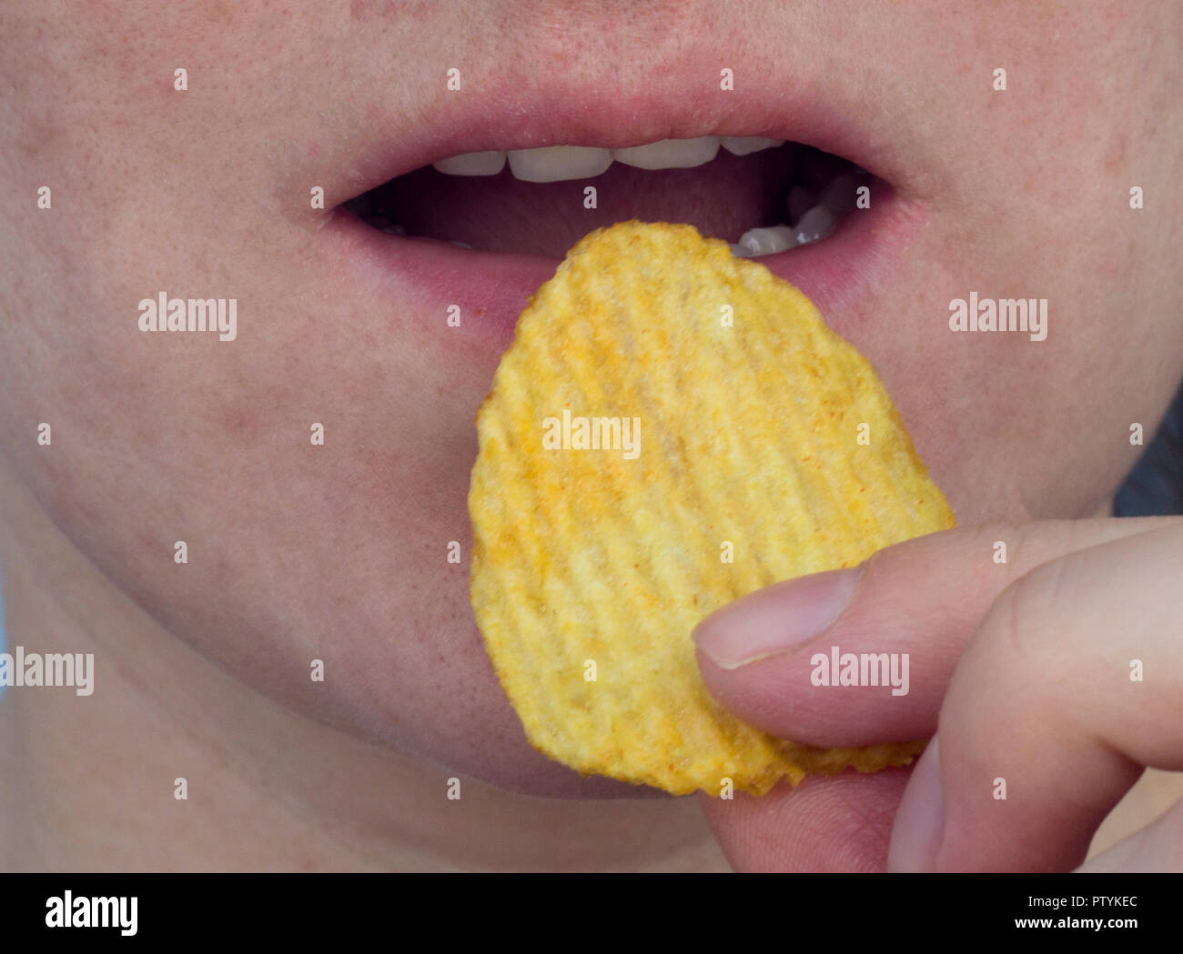 Fat girl eating chips hi-res stock photography and images - Alamy