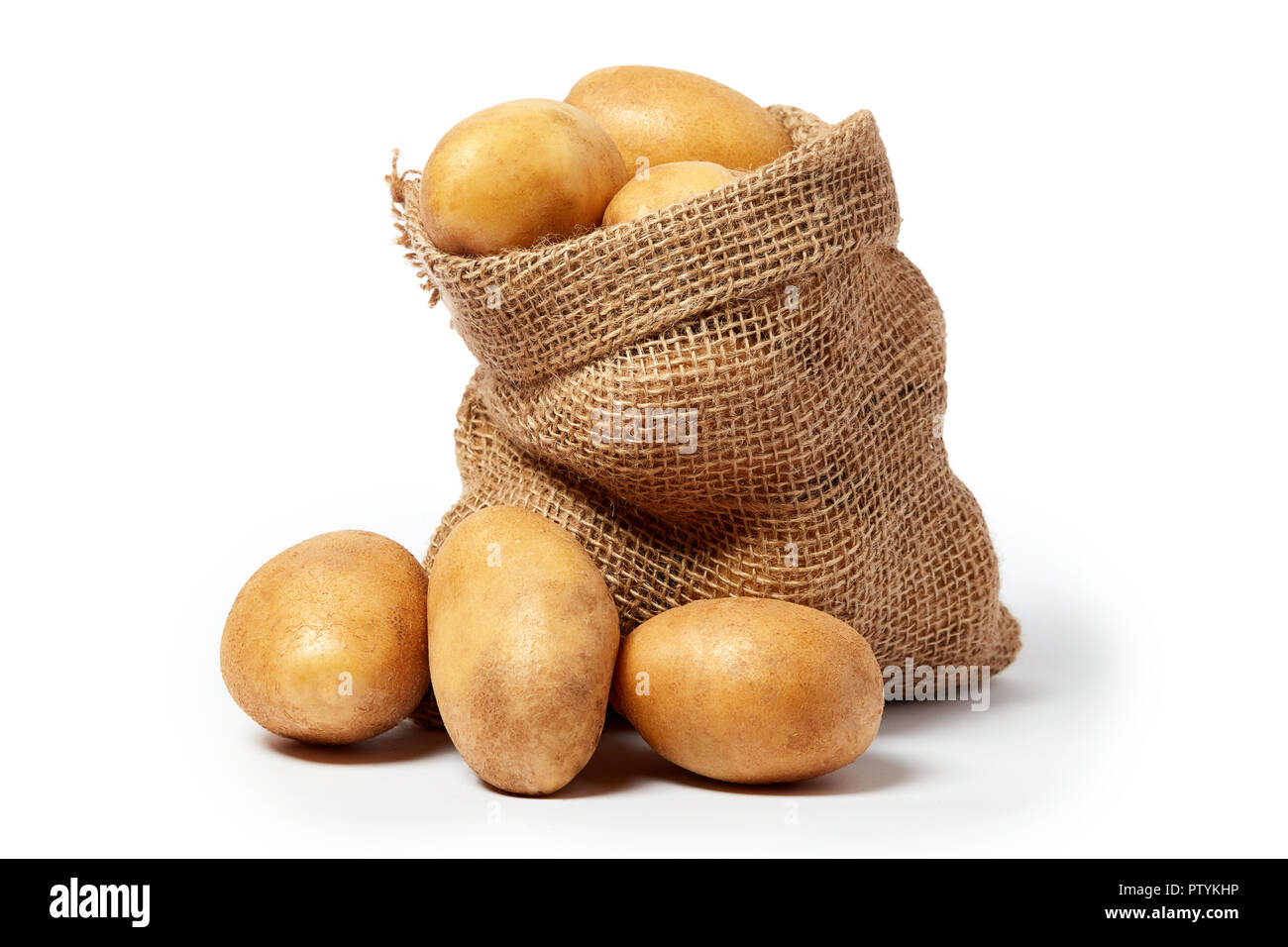 Burlap sack of fresh raw potatoes isolated on white background Stock ...