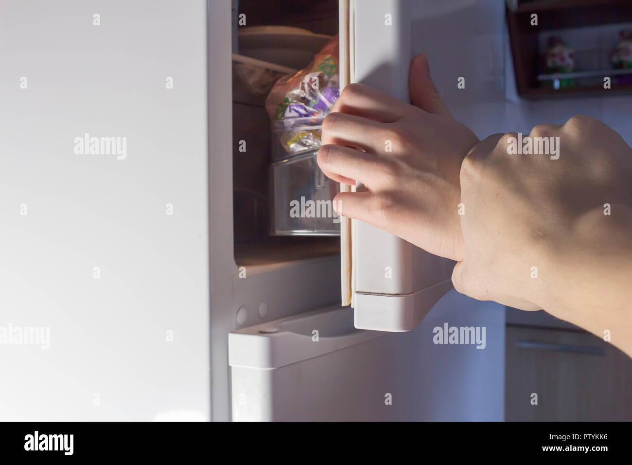 Hand opening refrigerator hi-res stock photography and images - Alamy