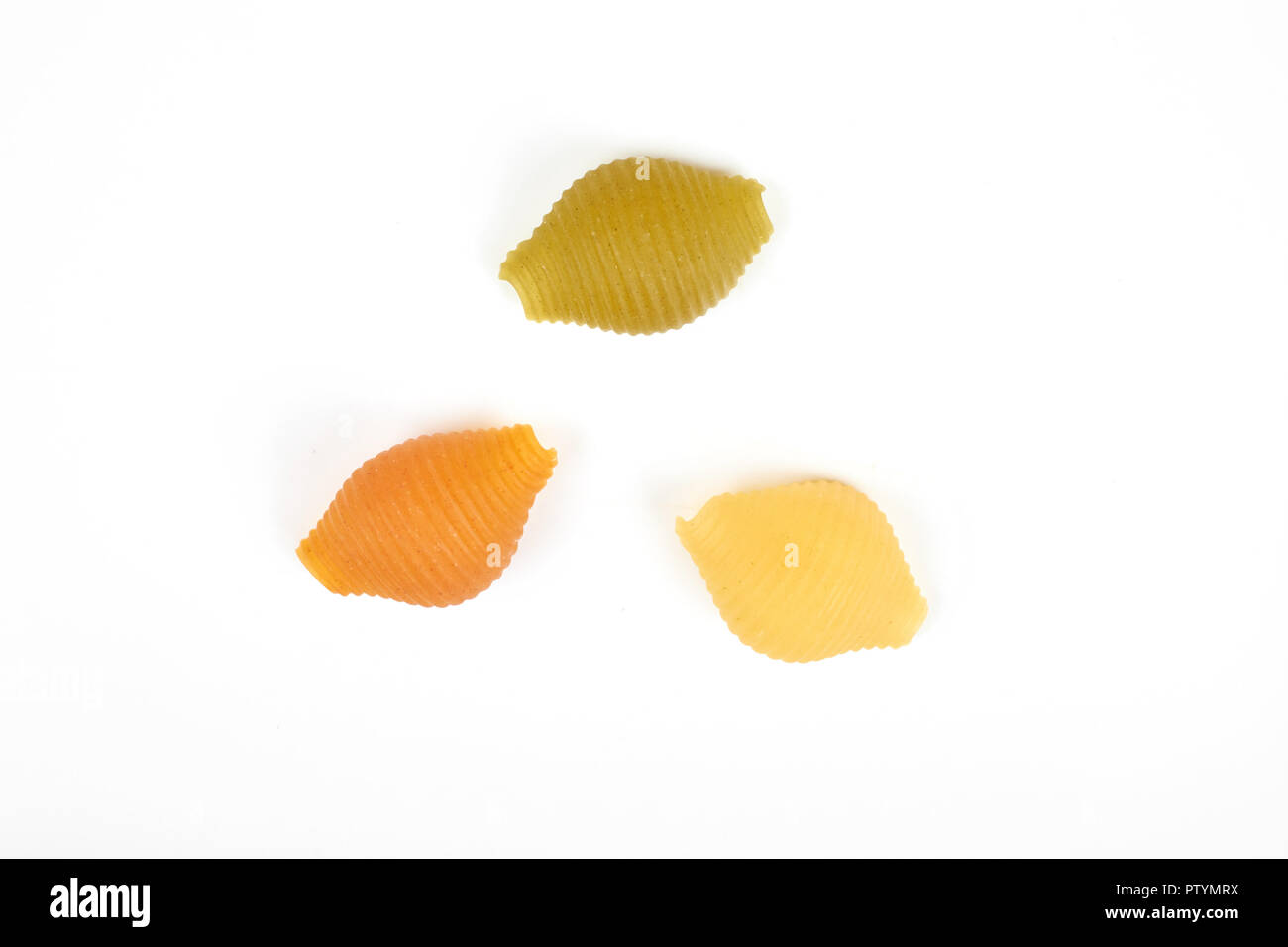 three colors conchiglie paste isolated on white background Stock Photo ...