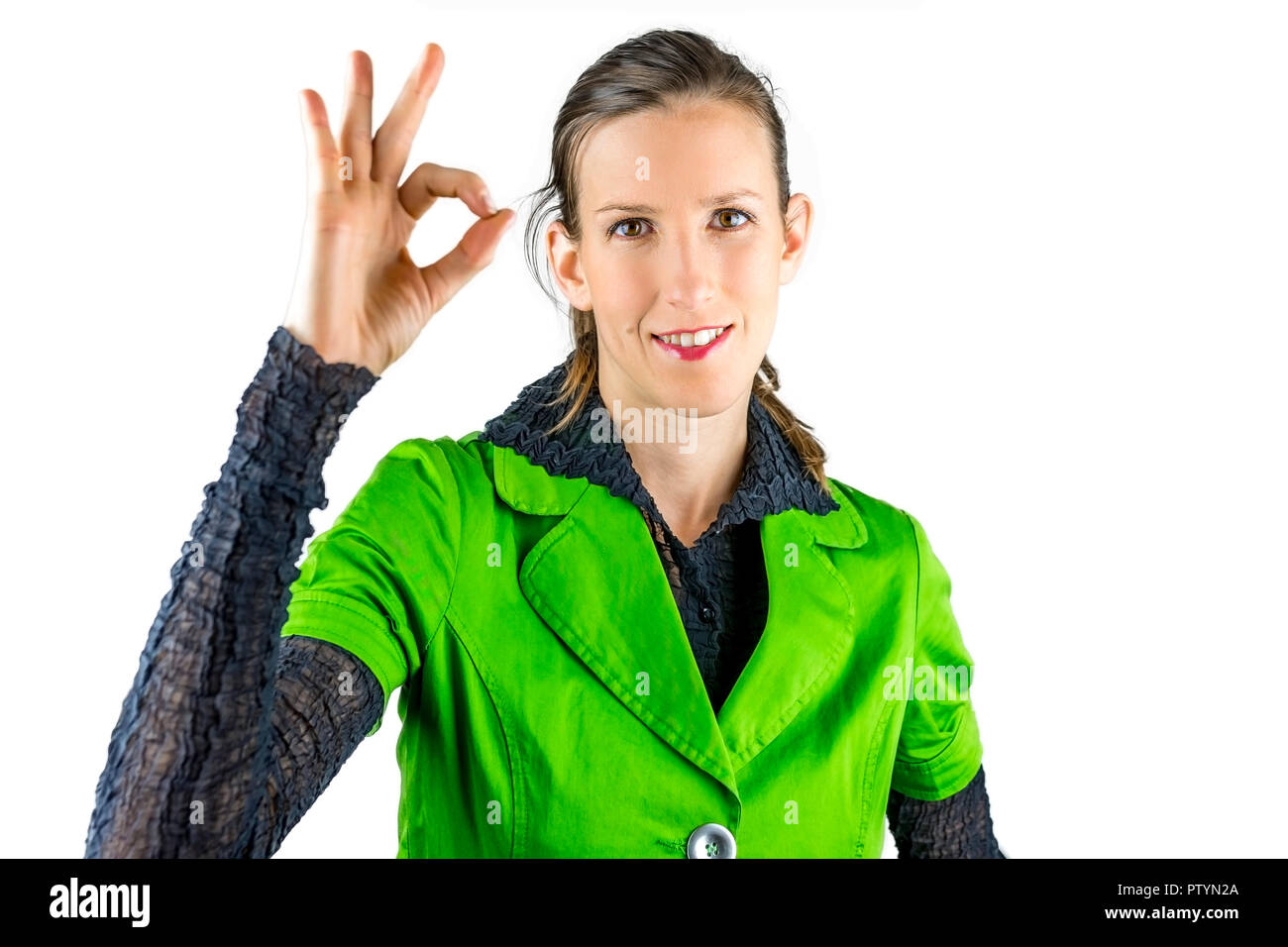 Young business woman making an OK hand gesture. Isolated over white ...