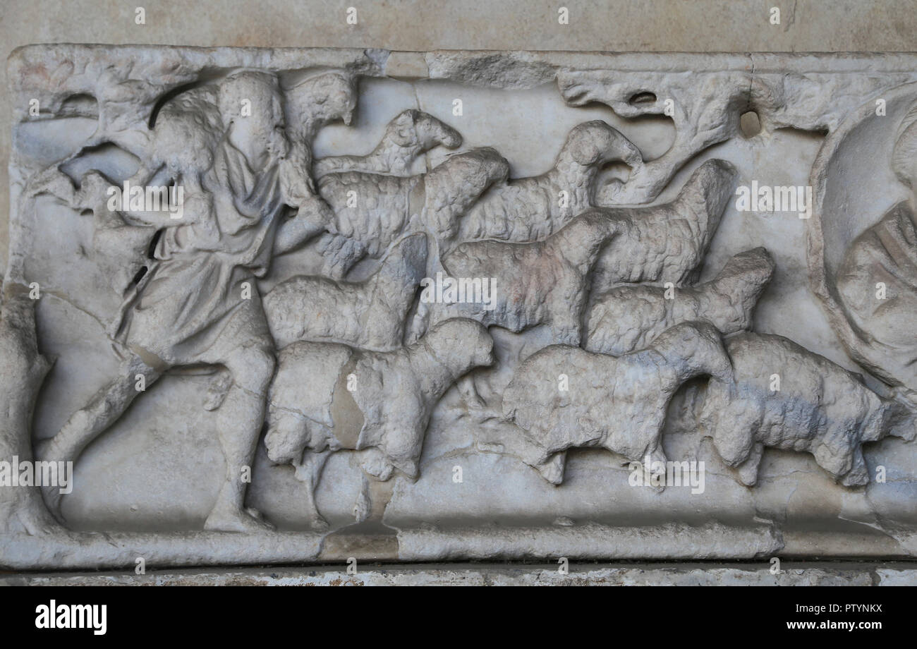 Figure with beard with lamb on his shoulders and flock. Roman ...