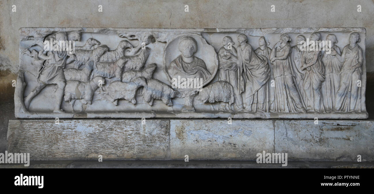 Roman sarcophagus. Central clypeus. To the sides, man with lambs and ...