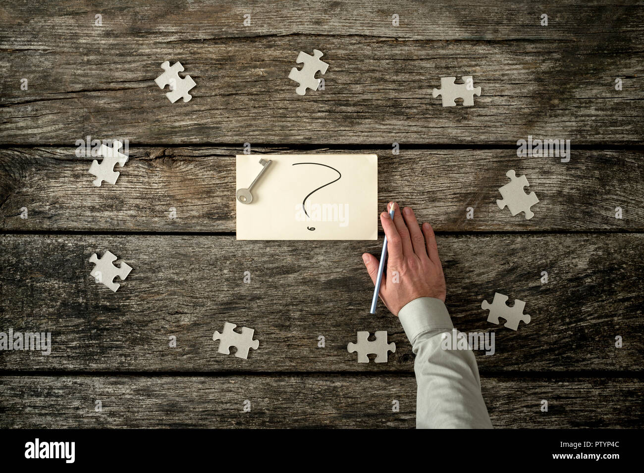 Eight blank puzzle pieces spaced evenly around hand written question ...