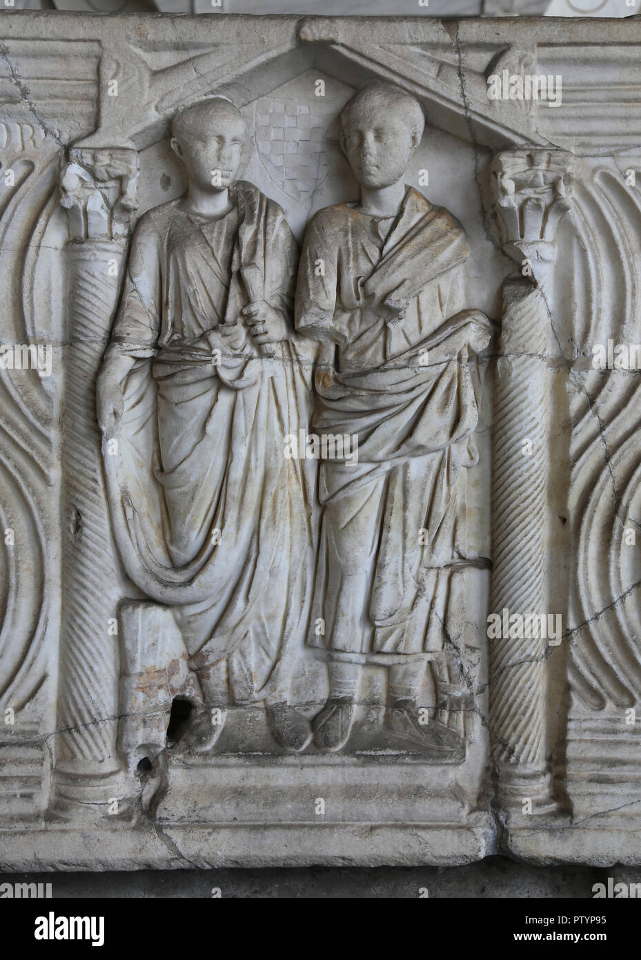 Roman sarcophagus. Strigilated ornament, portraits of the deceased in ...