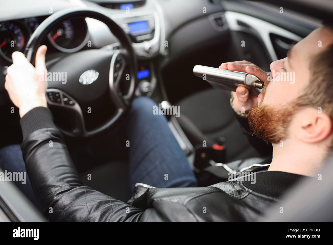 Drunk driver driving a car. Driving in a state of intoxication.Young ...