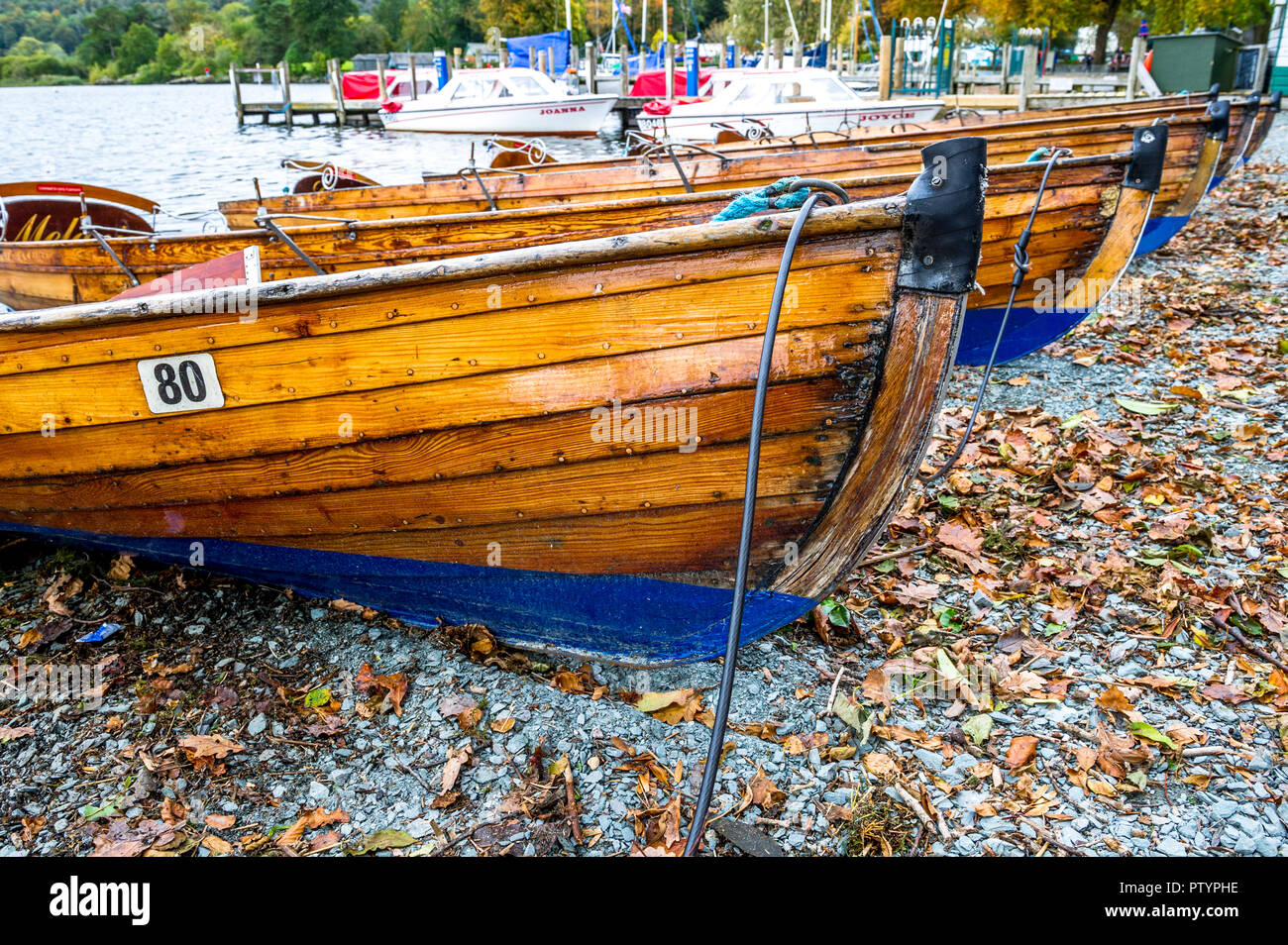 Traditional wooden rowing boats on the lake shore at Bowness-on ...