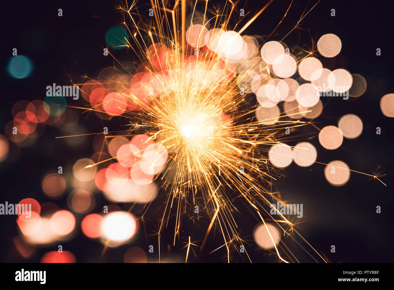 Fire Sparkle With Defocused Lights Stock Photo - Alamy