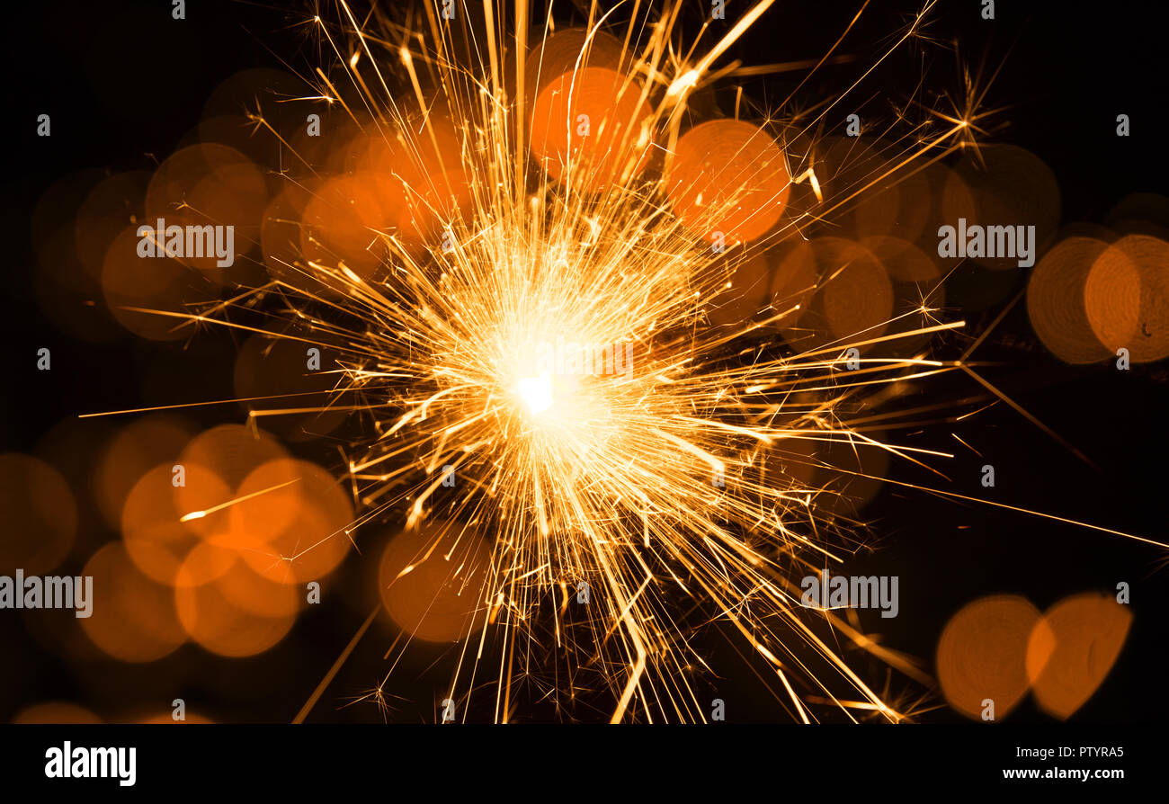 Fire Sparkle With Defocused Lights Stock Photo - Alamy