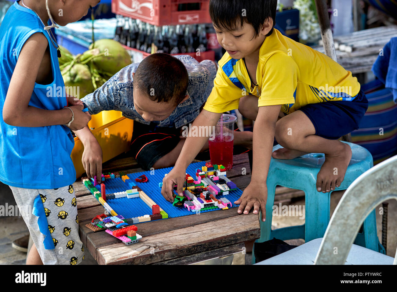 Lego. Children playing outside with a Lego building set. Thailand ...