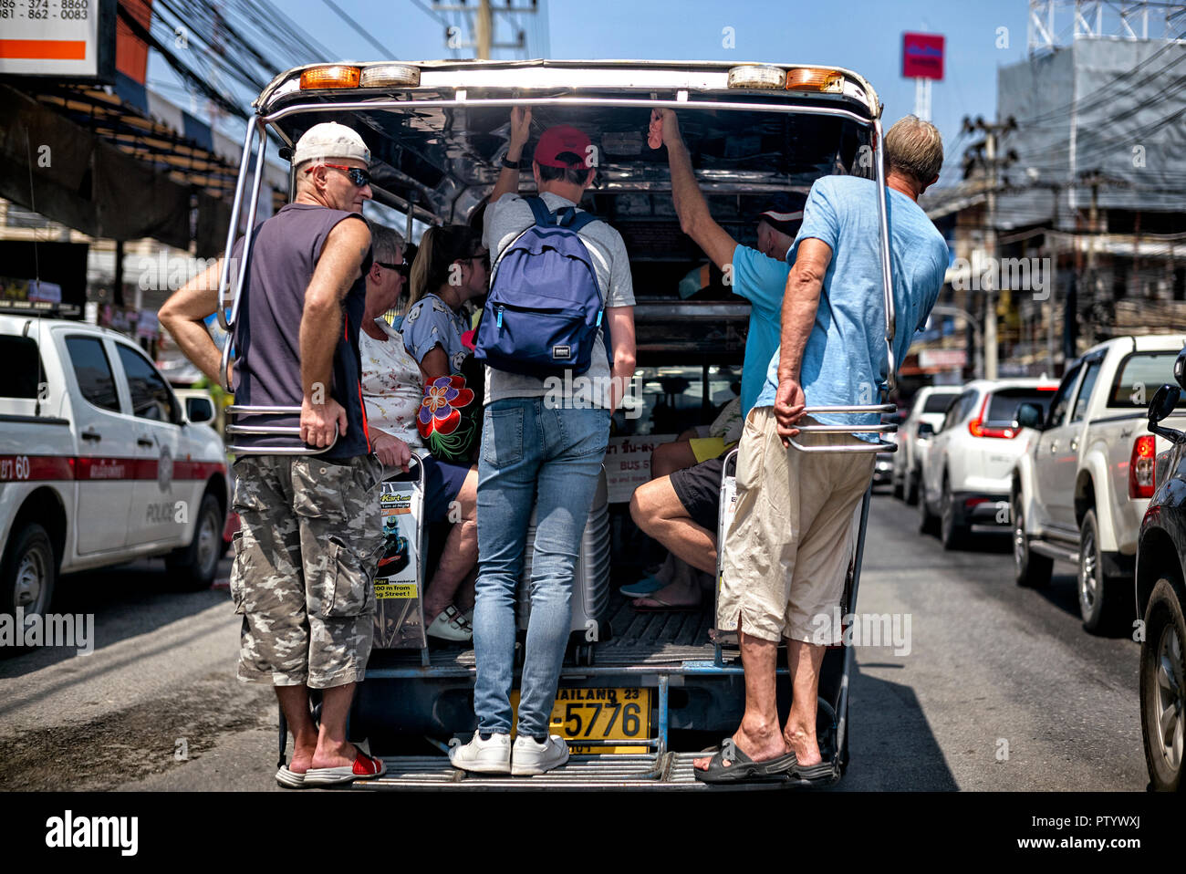 People riding on a Thailand songthaew public baht bus Stock Photo - Alamy