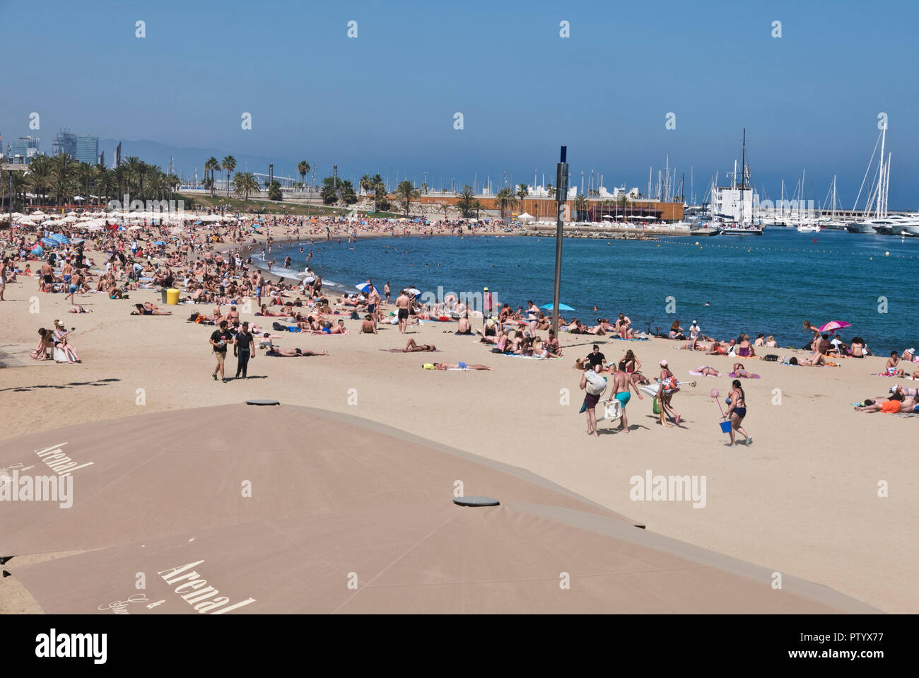 People sunbathing and relaxing on the beach of Barcelona, Spain Stock ...