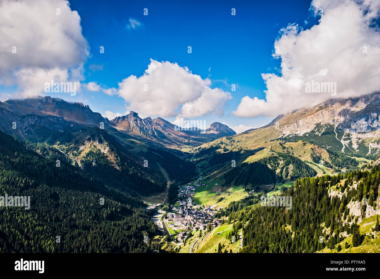 View of the Dolomites with view to the village Arabba Stock Photo - Alamy
