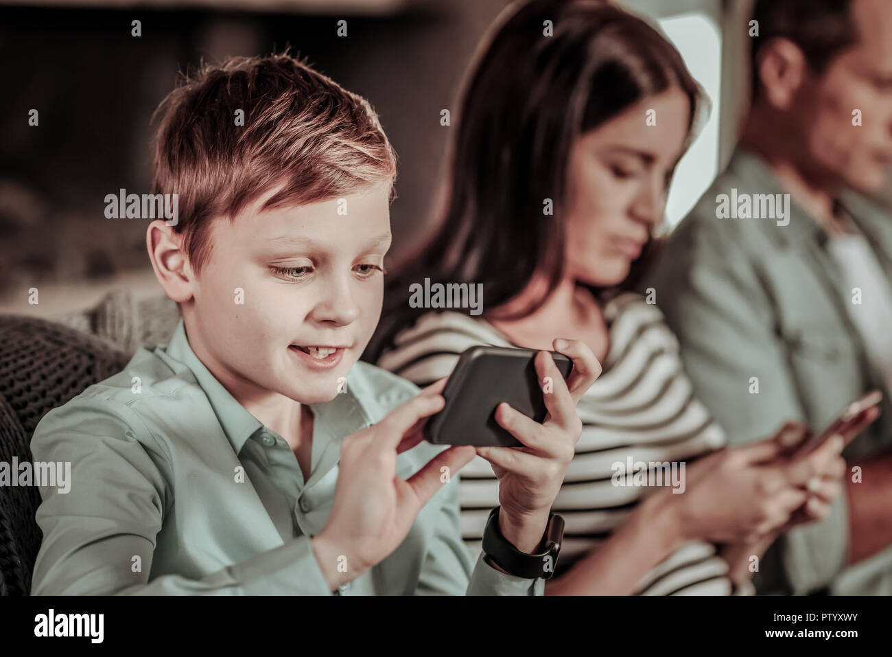 Preteen boy using smartphone hi-res stock photography and images - Alamy