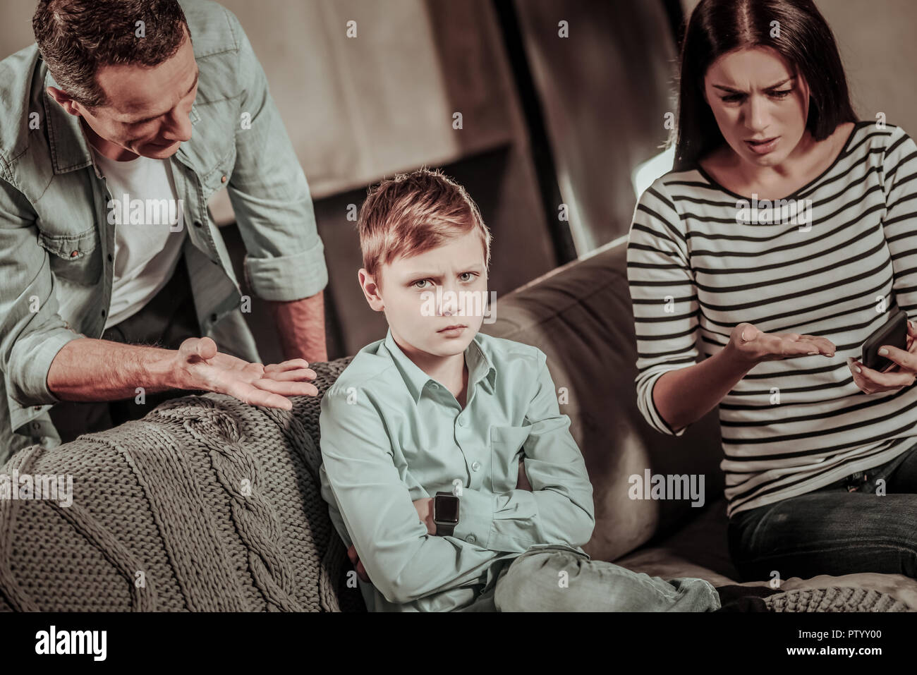 Bored child showing his negativity on camera Stock Photo - Alamy