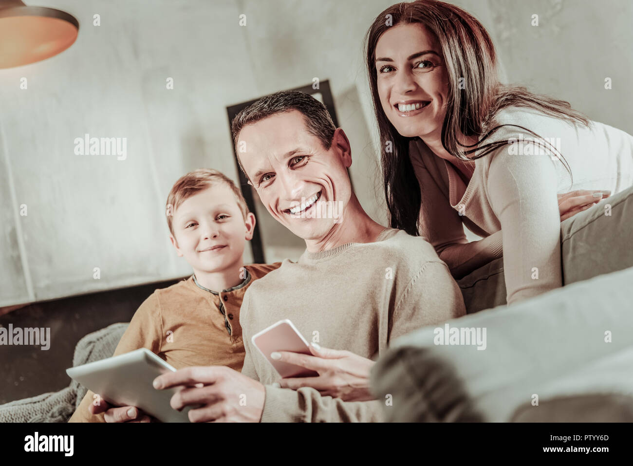 Positive delighted people posing on camera together Stock Photo - Alamy