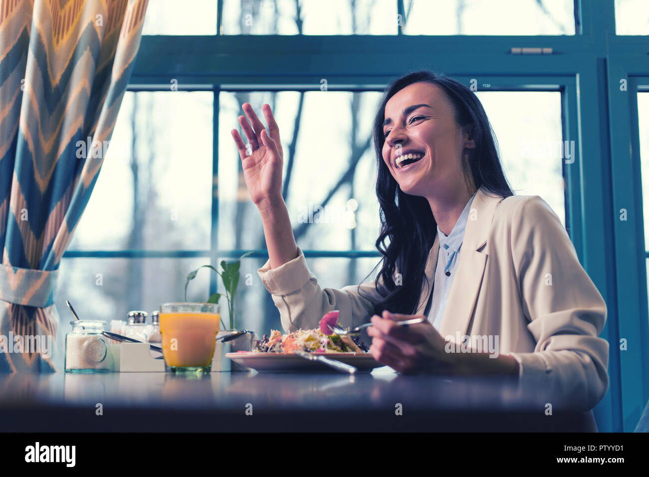Happy female person laughing at funny joke Stock Photo - Alamy
