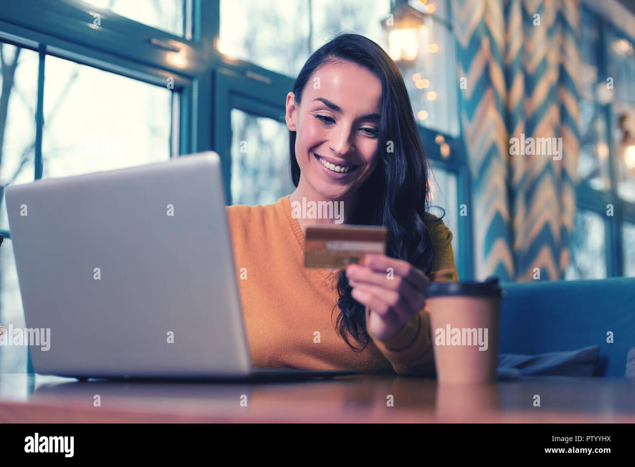 Beautiful brunette female keeping smile on her face Stock Photo - Alamy