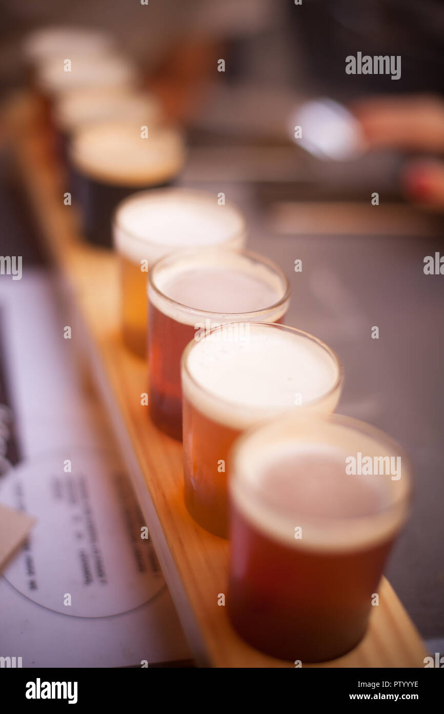 Selection of beers on a tasting mat Stock Photo - Alamy