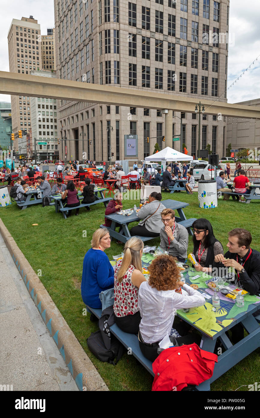 Detroit, Michigan - People eat lunch on a warm autumn day in Spirit ...