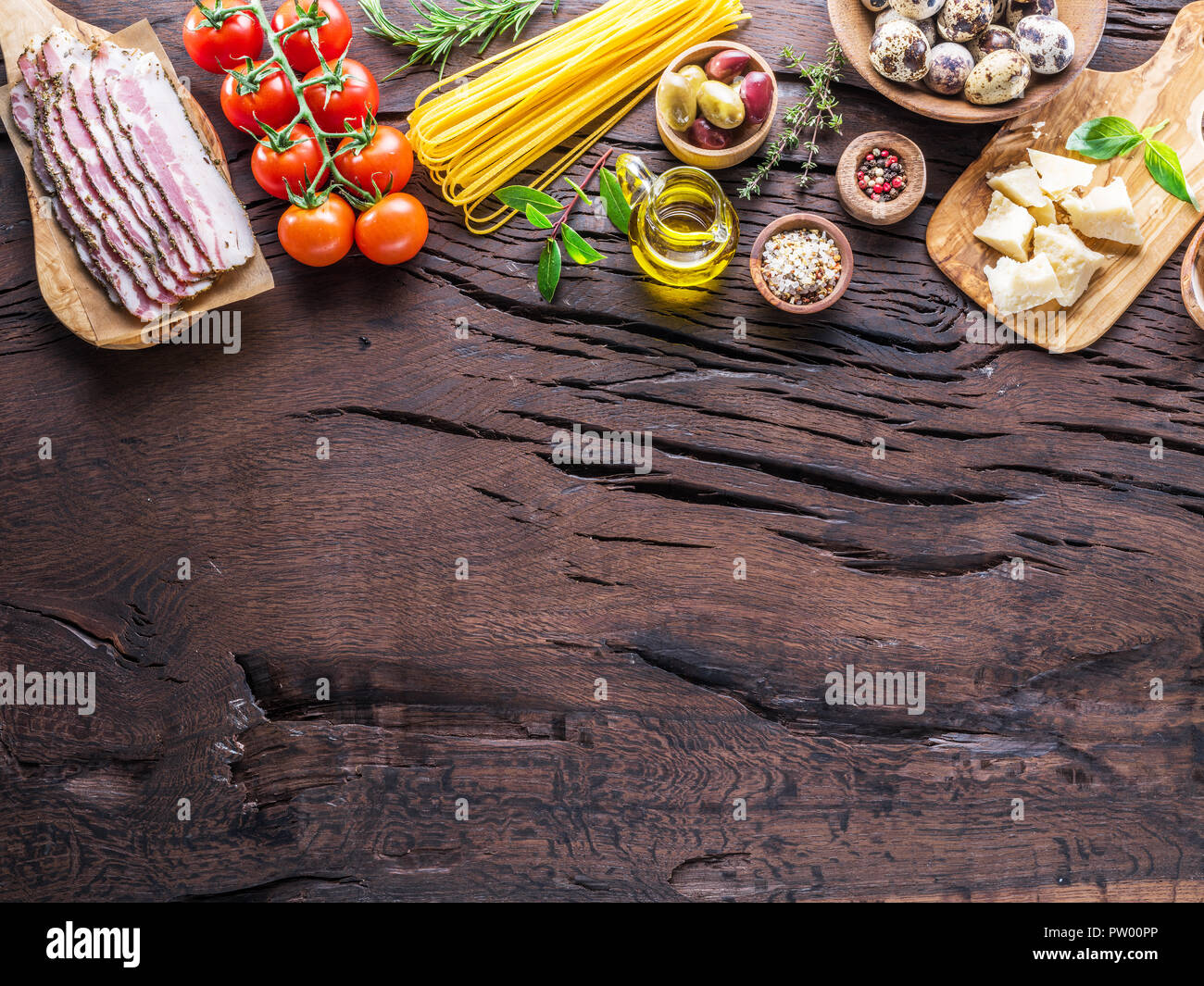 Variety of food on the wooden table. Top view Stock Photo - Alamy