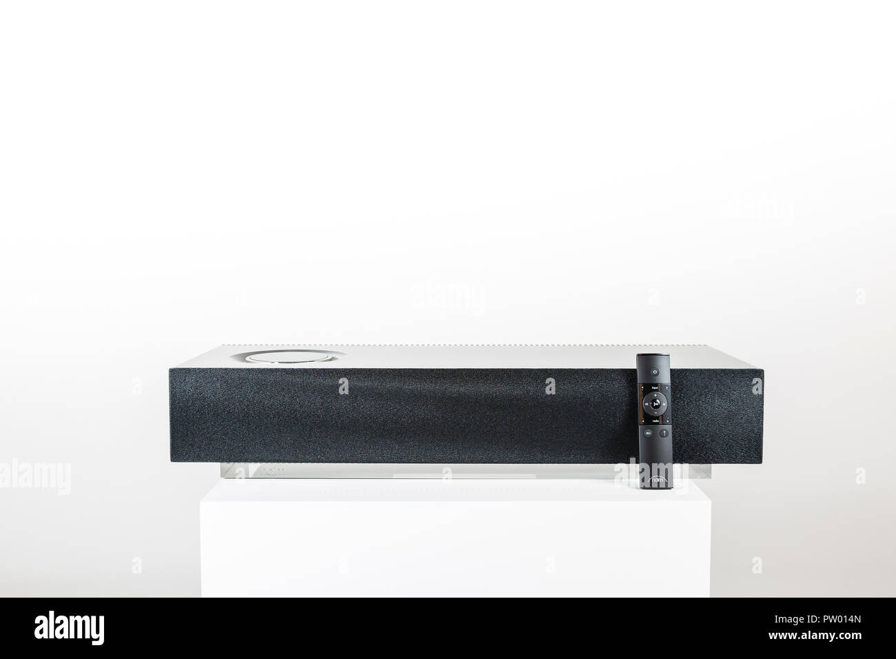 London, UK. High-end Naim Mu-So speaker in studio with remote control ...