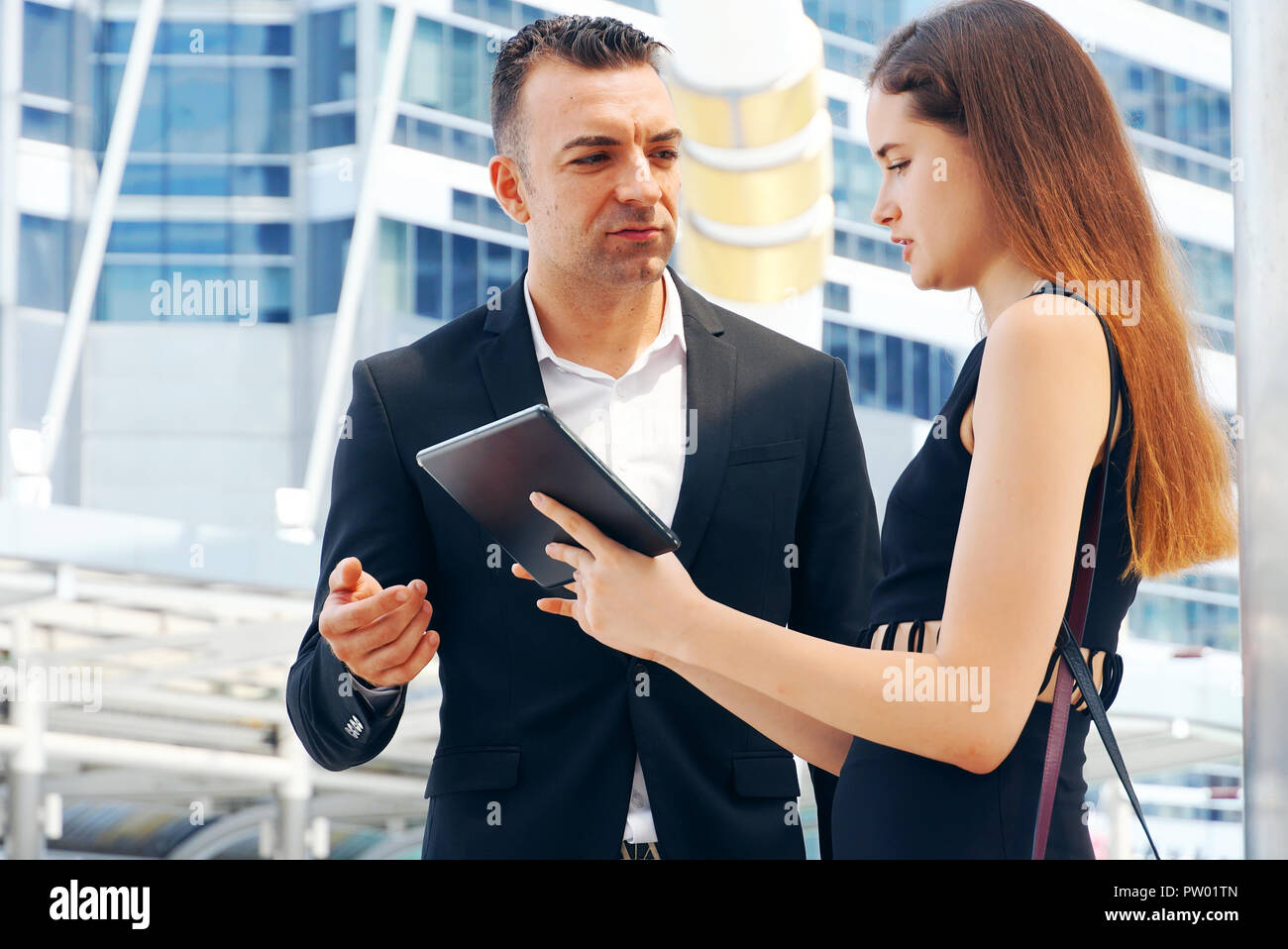 Businessman and secretary planning business together Stock Photo - Alamy