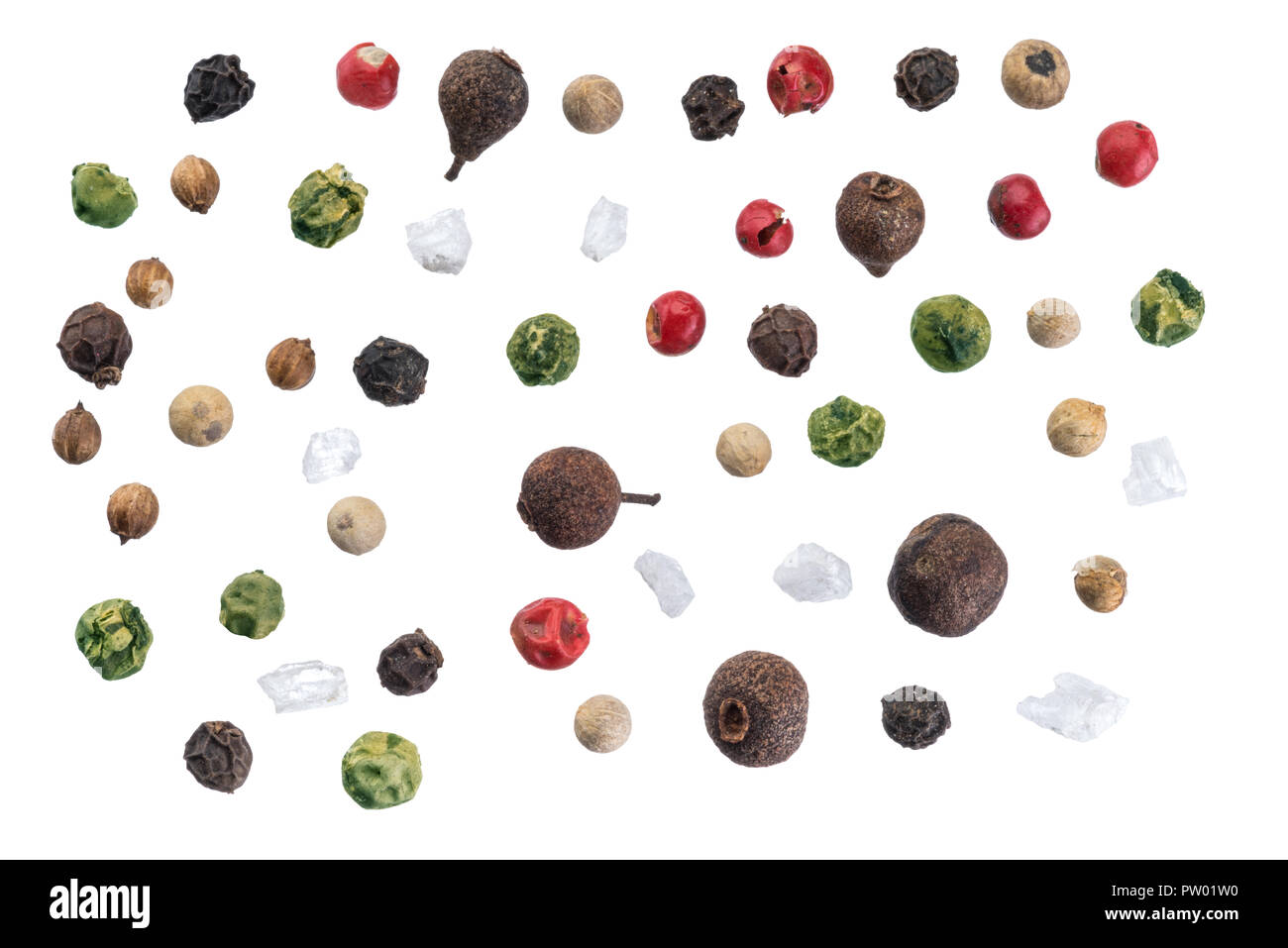 Different colored peppercorns isolated on white background. File ...