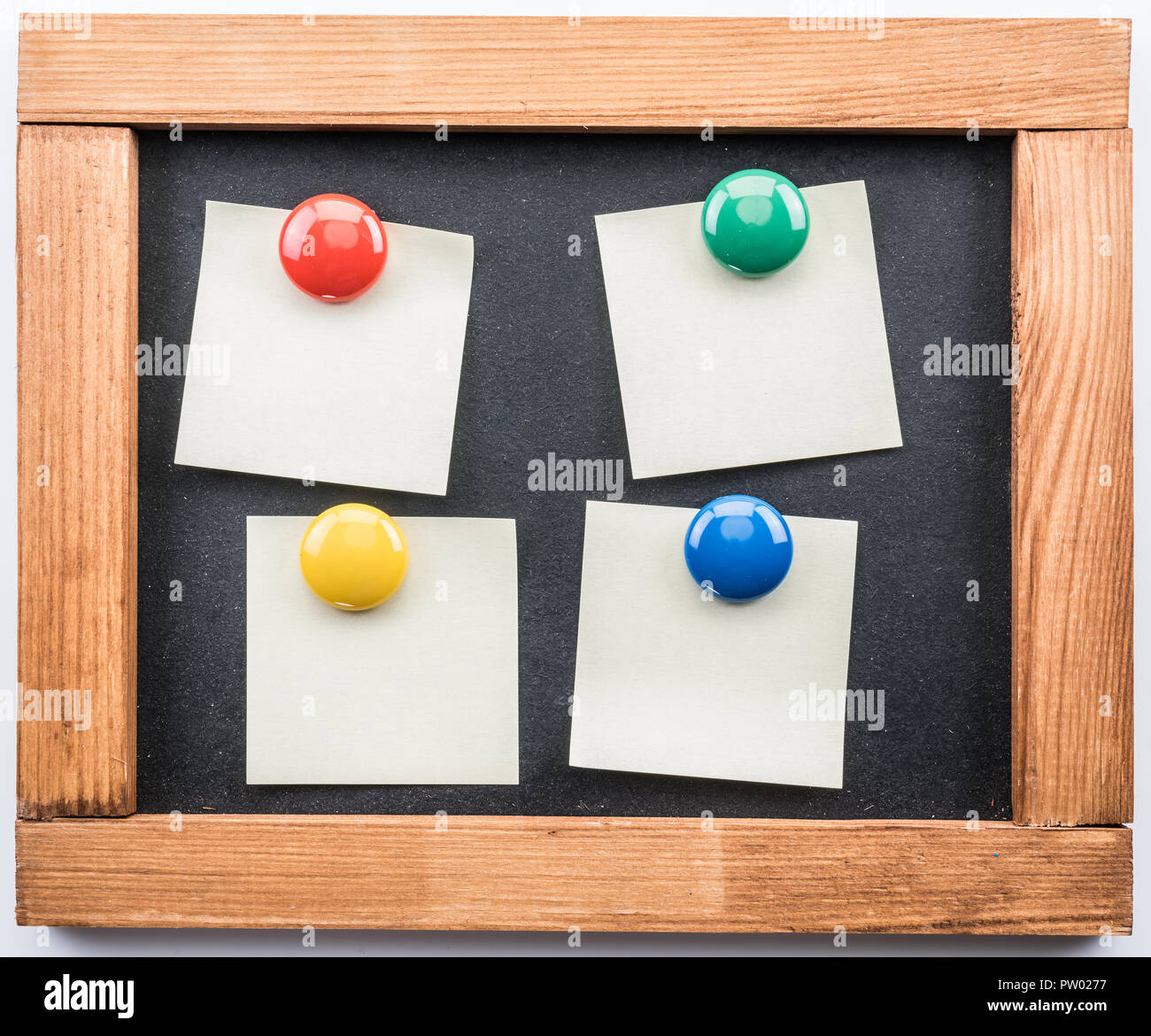 Blackboard and post-it notes stuck with colorful magnets Stock Photo ...