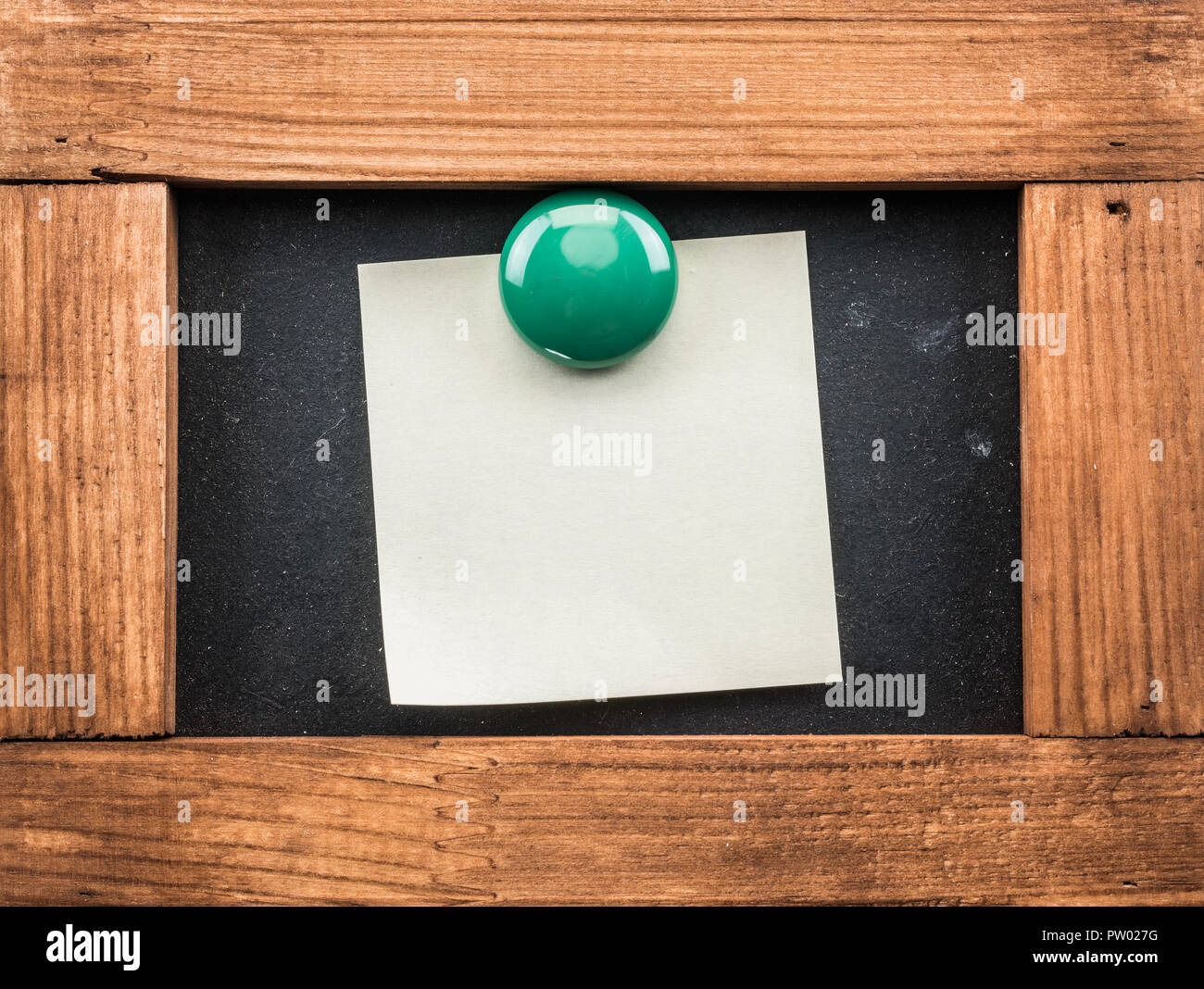 Blackboard and post-it notes stuck with colorful magnets Stock Photo ...