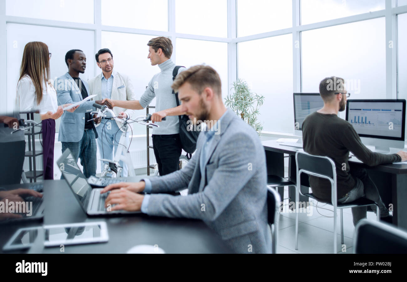 employees working on computers in the office Stock Photo - Alamy
