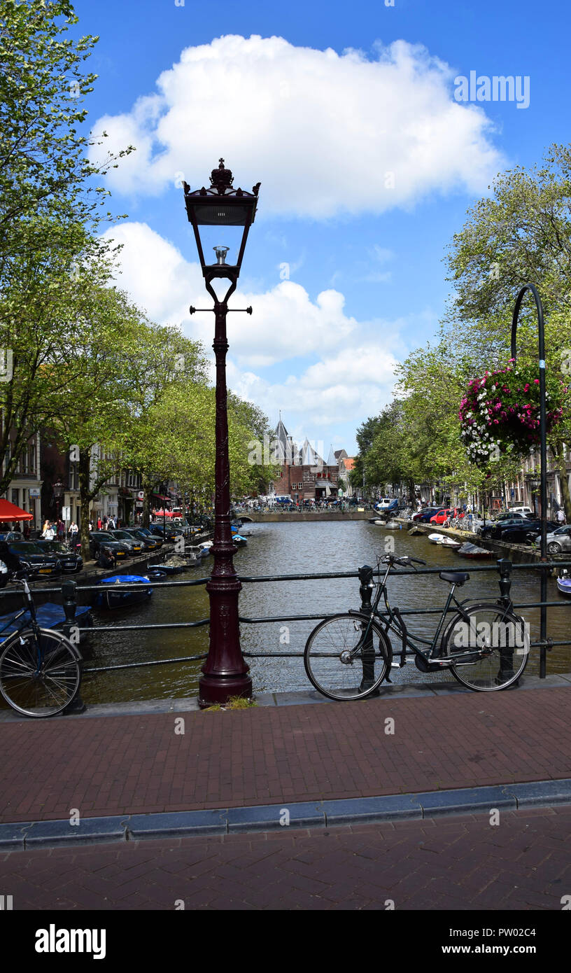Street lamp on a bridge across the canals of Amsterdam´s historic ...