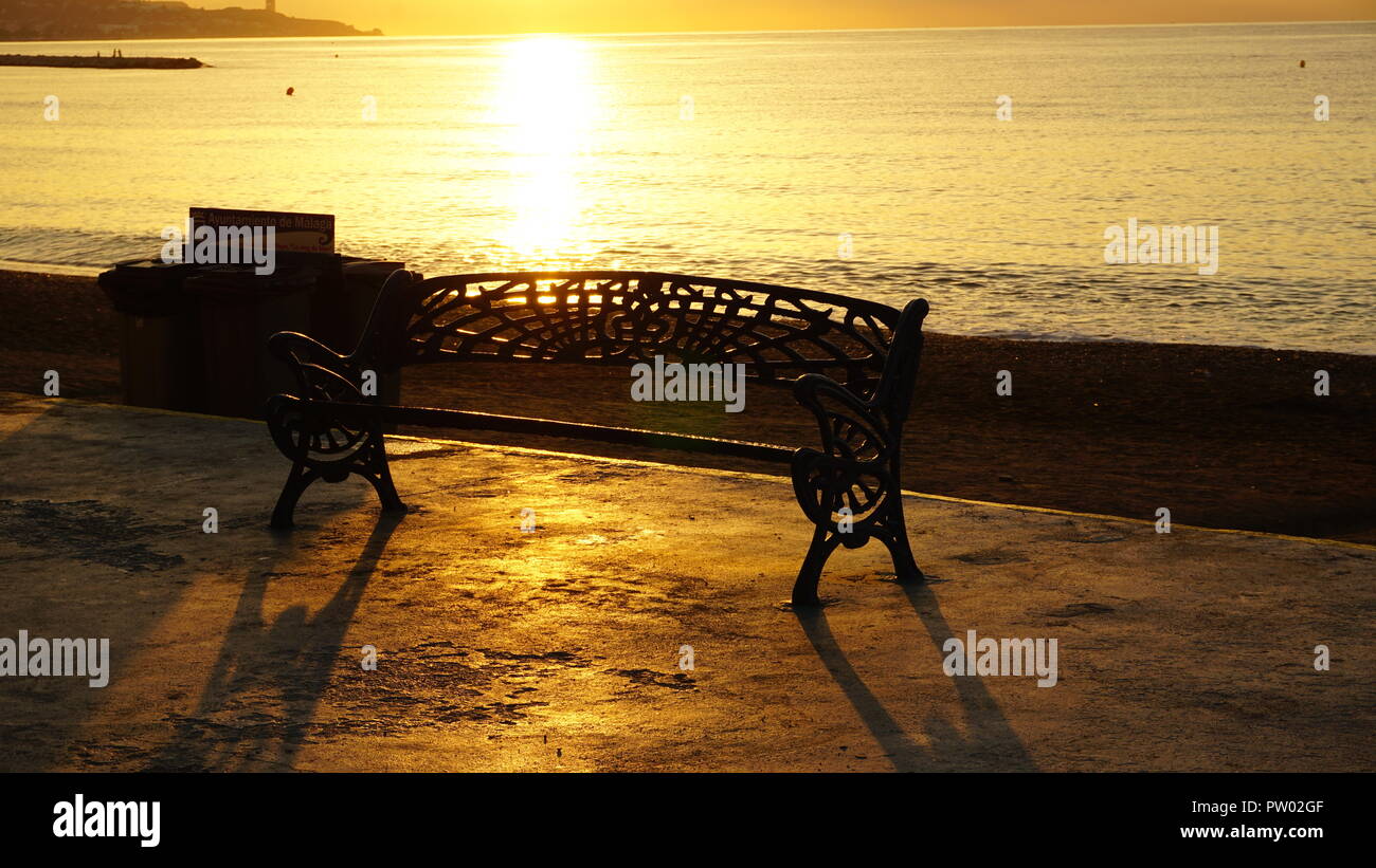 bench in the sun during sunrise in Malaga Stock Photo - Alamy