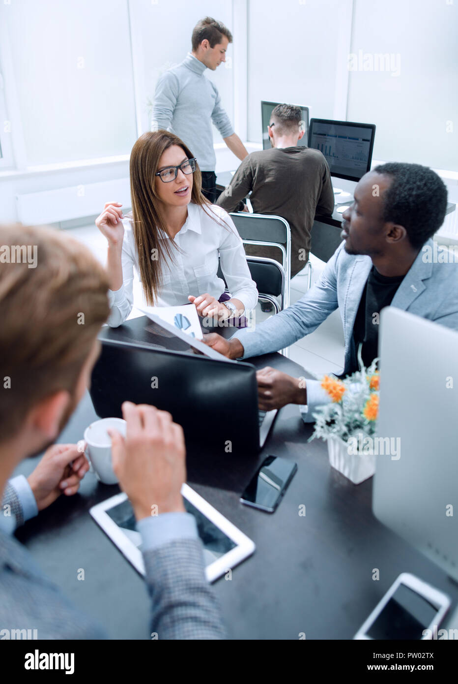 Multinational team in office discussing hi-res stock photography and ...