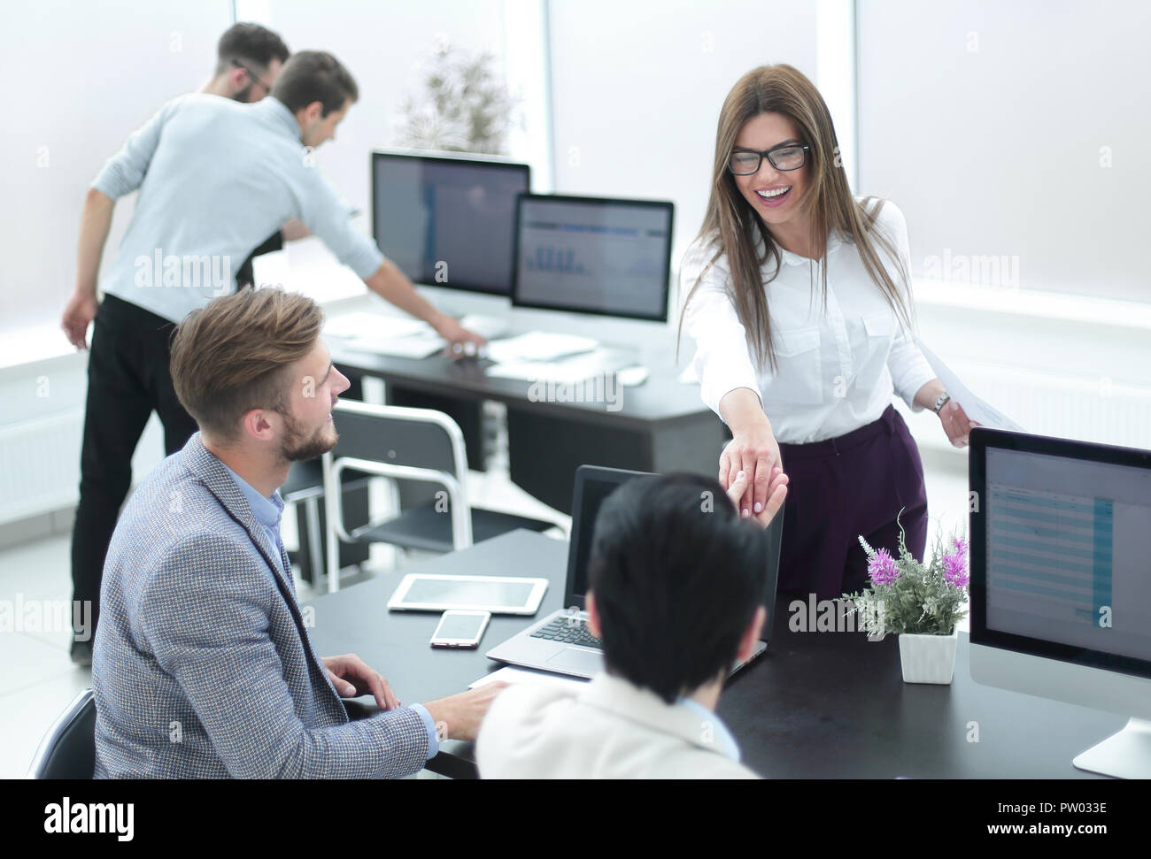 successful employees in the workplace in a modern office Stock Photo ...