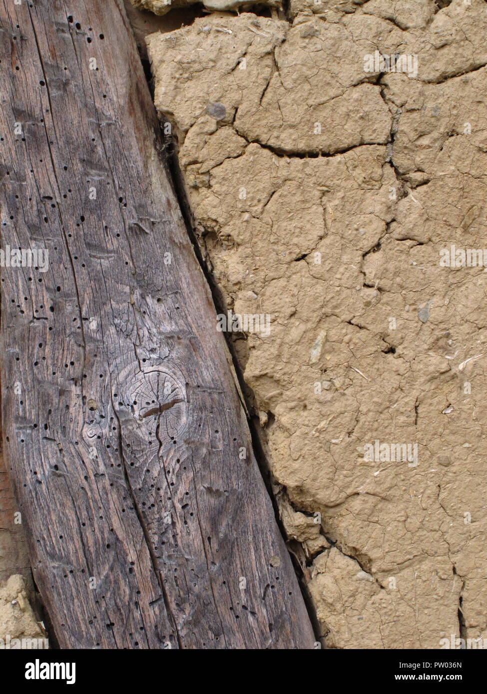 Background of wooden plank in mud, clay wall Stock Photo - Alamy