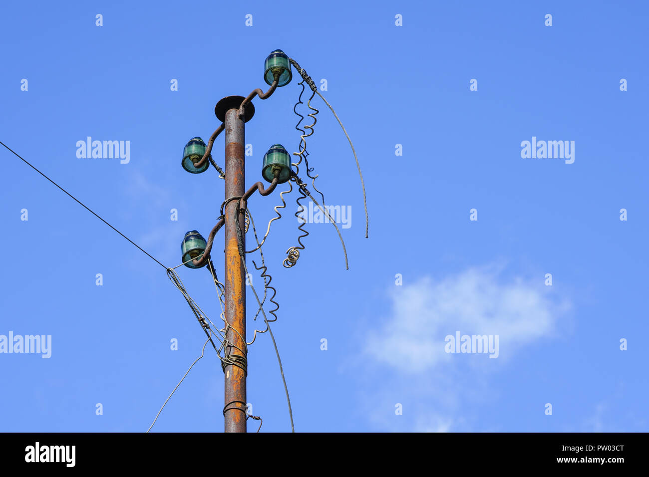 old electric pillar with glass insulators and disconnected wires Stock ...
